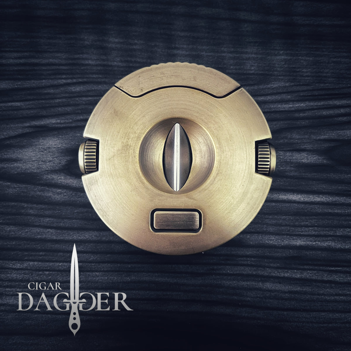 The Orbit V Cut Cigar Cutter With Punch in Brass – Cigar Dagger